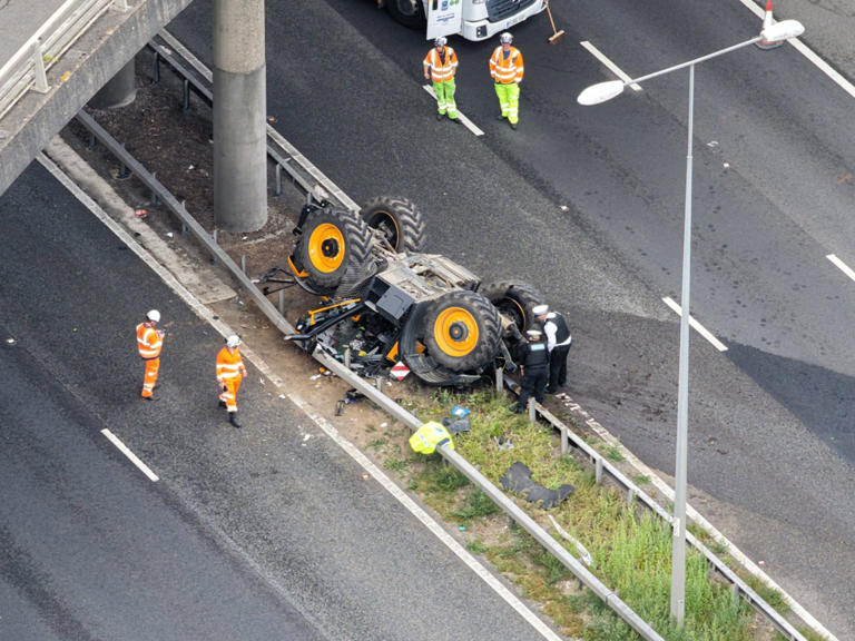 M20 shut as tractor plunges off bridge in Kent