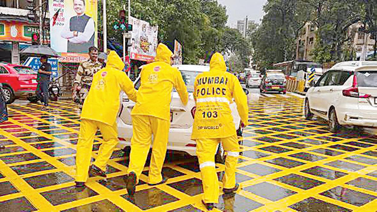 Mumbai rains: Cops wade in, rescue children, clear traffic chaos