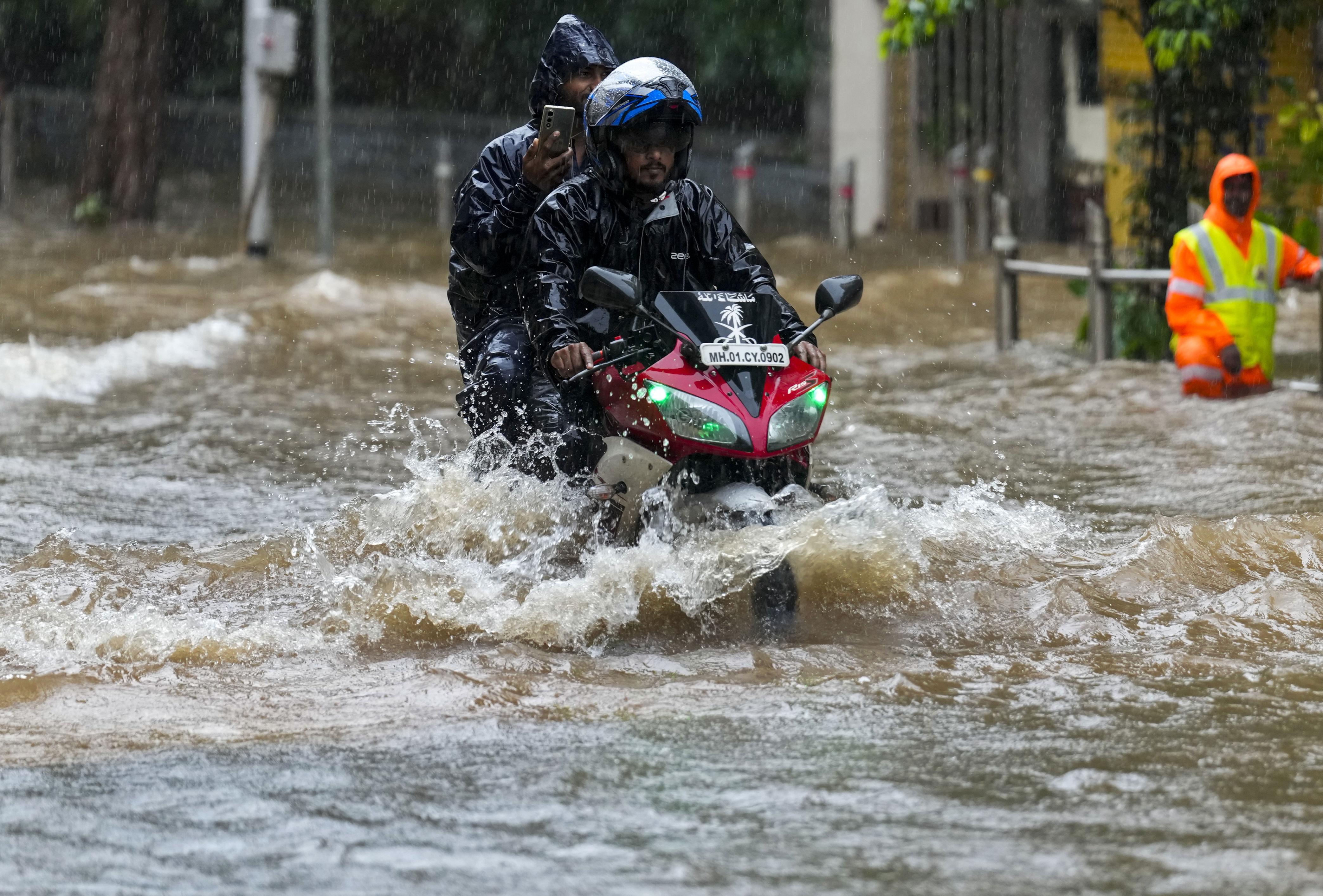 Mumbai reels under torrential rain; train services hit, normal life ...