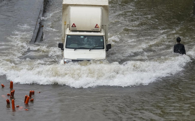 Mumbai reels under torrential rain; train services hit, normal life ...