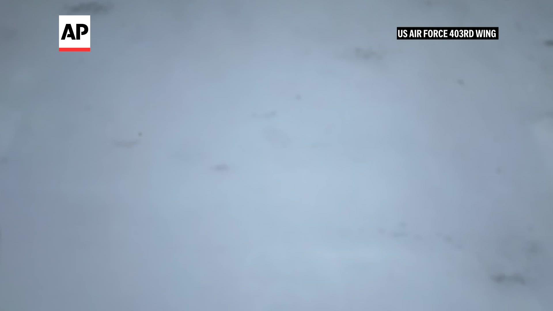 Dramatic view of Hurricane Erin's eye as planes fly through powerful storm
