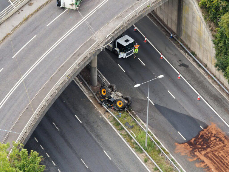 Man in hospital after tractor falls off bridge onto the M20