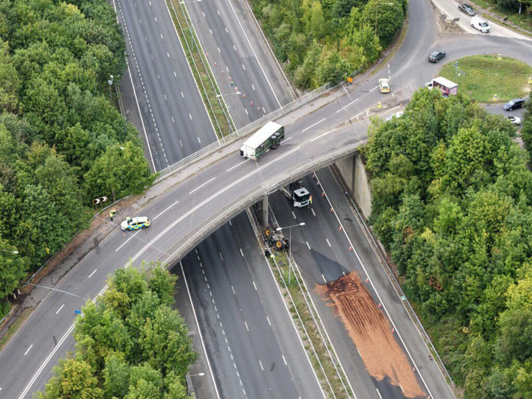 Man in hospital after tractor falls off bridge onto the M20