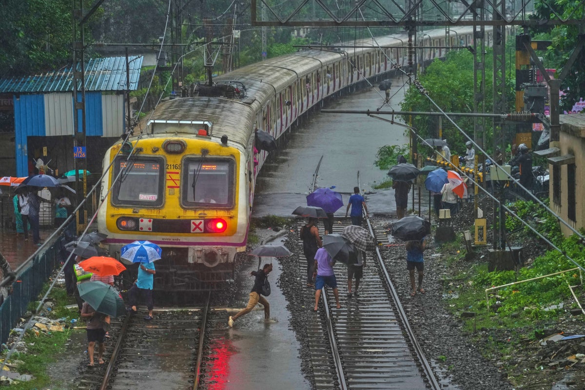 Photo of a stalled commuter train on a submerged track shows Mumbai’s ...