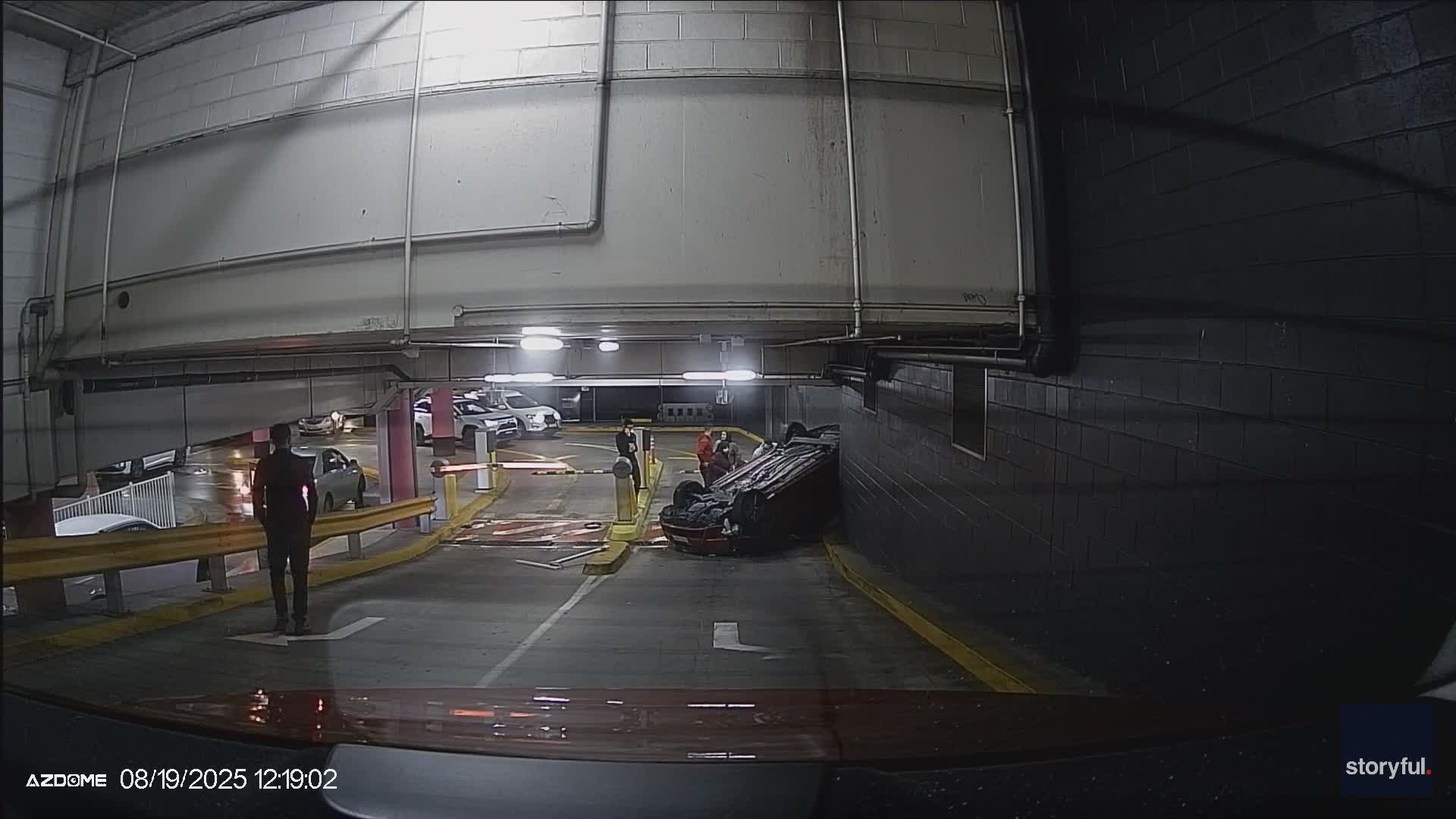 Bizarre Moment Car Flips in Parking Lot After Colliding With Gate