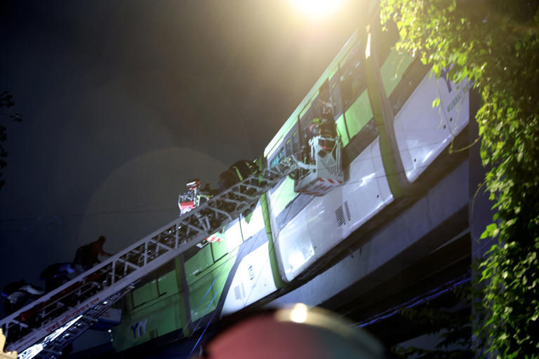 Gripped with fear and panic, some commuters mulled jumping off stranded ...