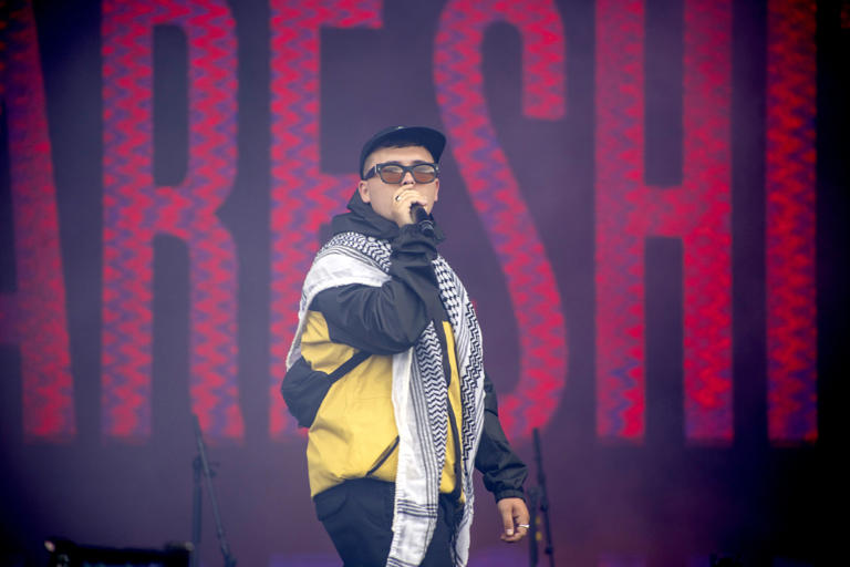 Hundreds of Kneecap supporters greet rapper Mo Chara as he appears at ...