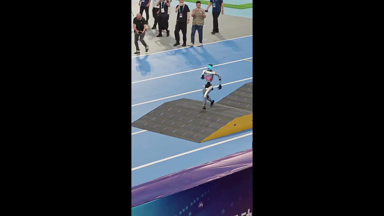 Humanoid robot takes on obstacle course on running track in China