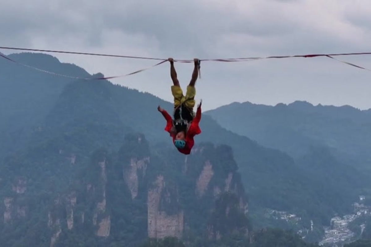 Competitors walk slackline 400m above Chinese gorge in bid for ...