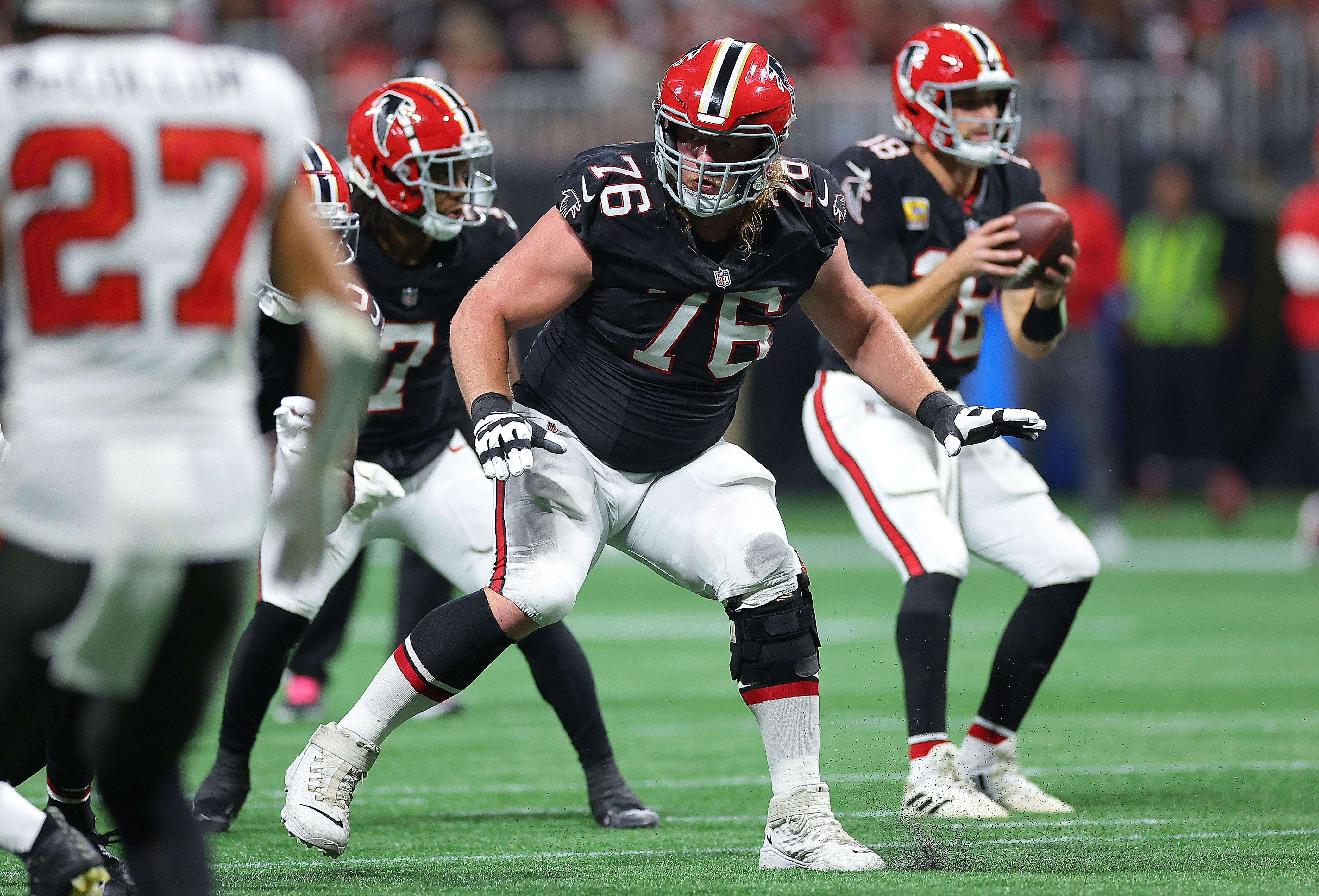 Falcons right tackle Kaleb McGary suffers left leg injury during practice