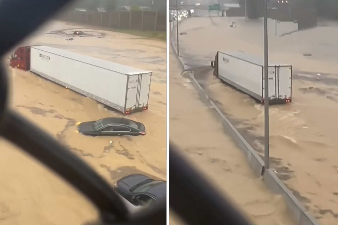 Video toont dat de overstroming de vrachtwagenchauffeur er niet van kon ...