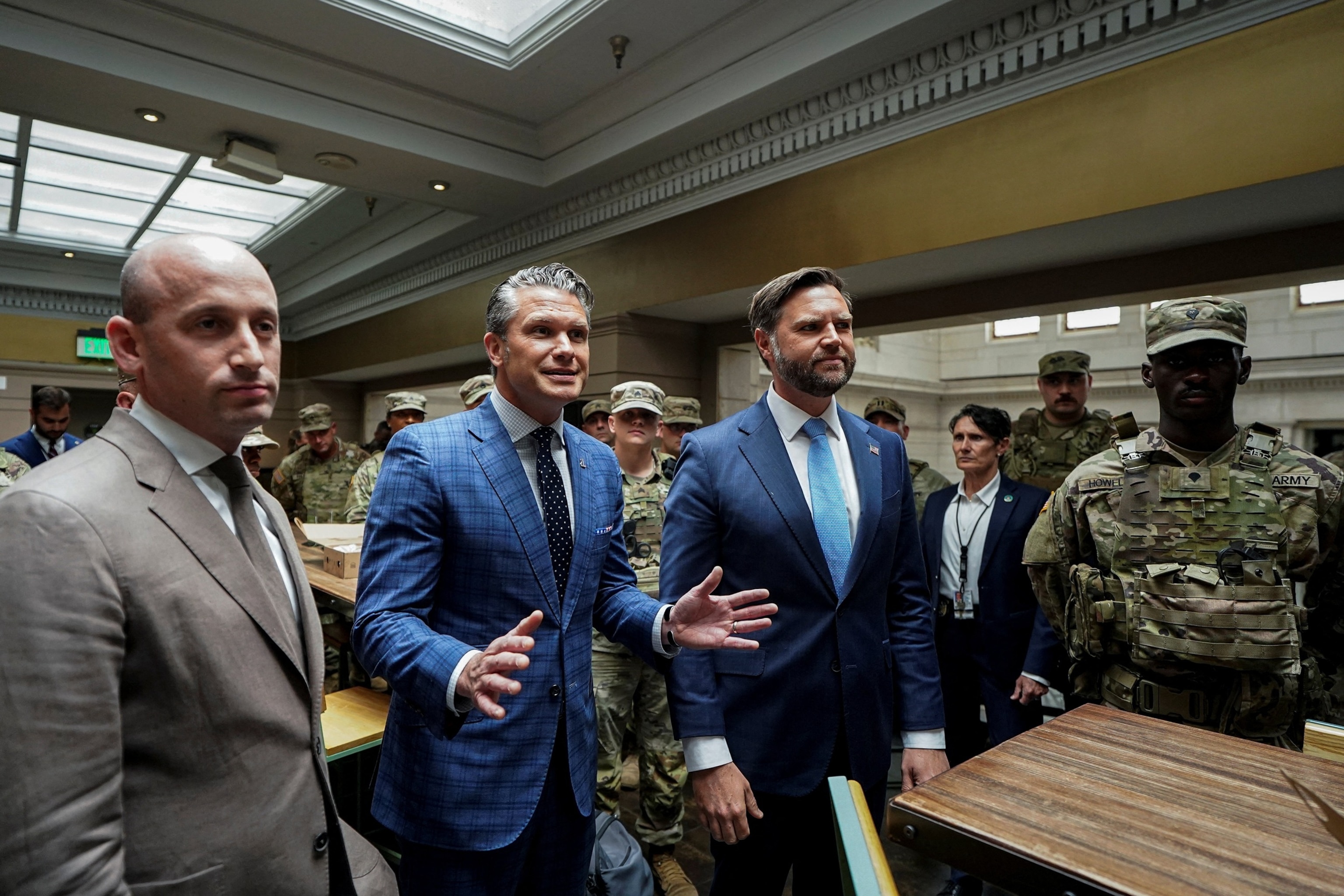 Protesters heckle Vance, Hegseth at photo op to thank National Guard ...