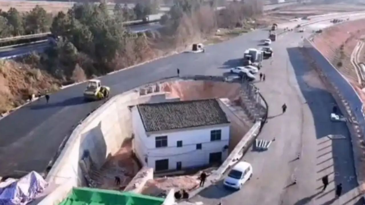 A family whose house was surrounded by a highway in China decides to ...