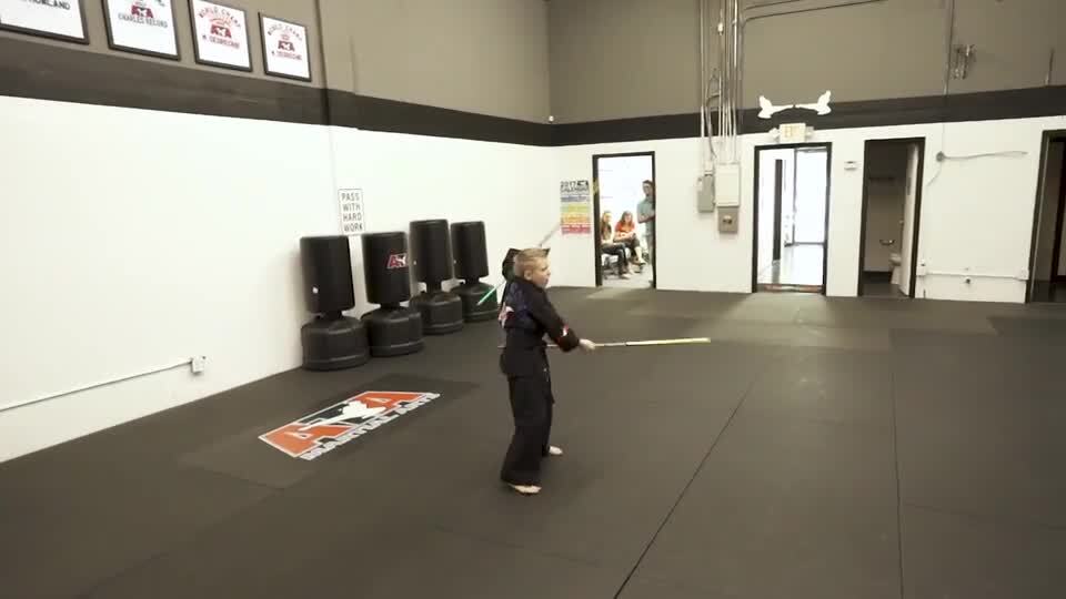 Kid Shows off Double Bo Staff Skills