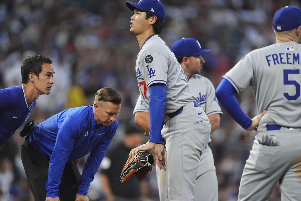 Dodgers' Ohtani roughed up by Rockies, leaves game after getting hit on ...