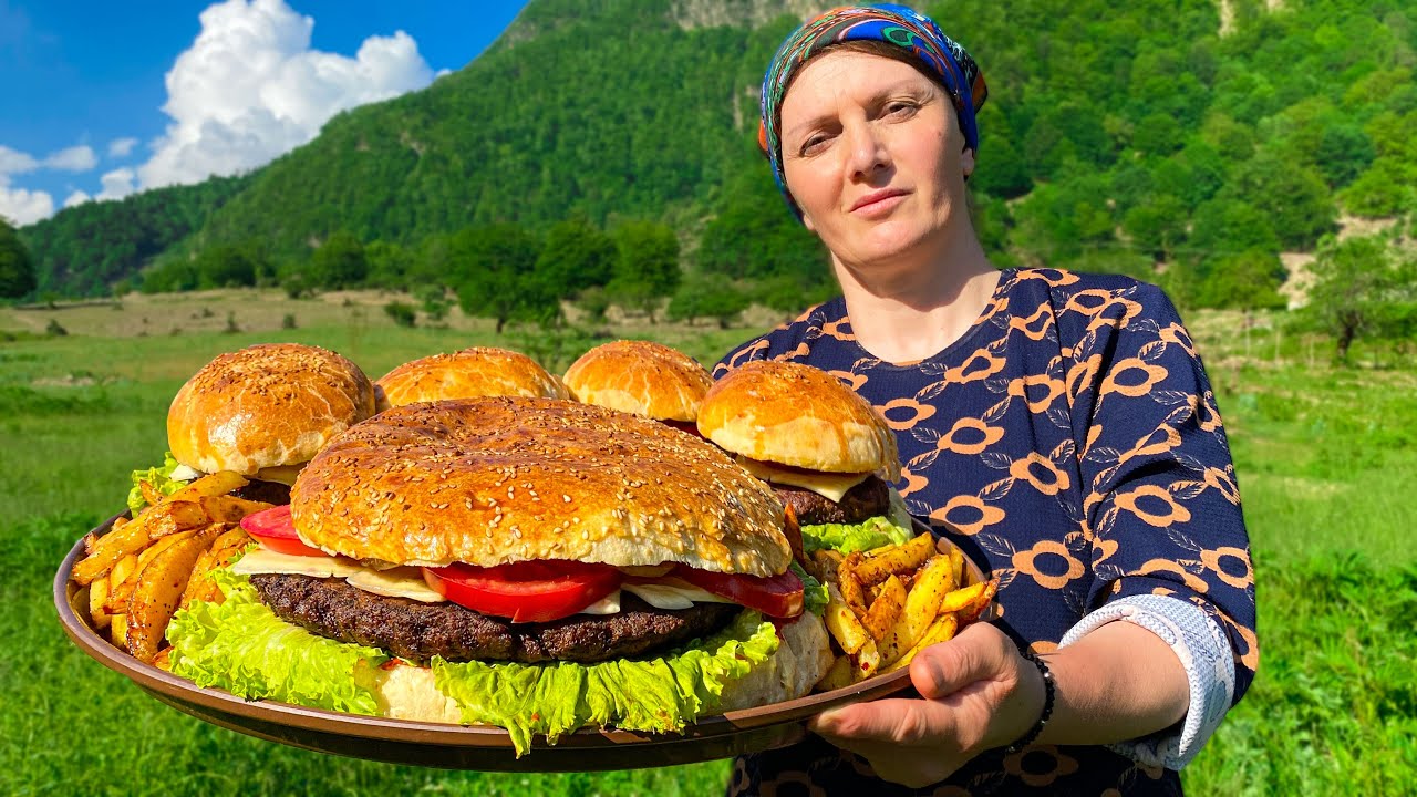Family-style burger feast cooked outdoors