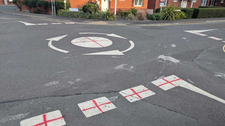Flag row continues as St George's Cross spray painted on mini ...