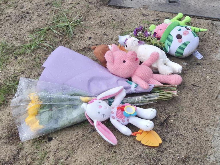 How city is mourning baby found in drain