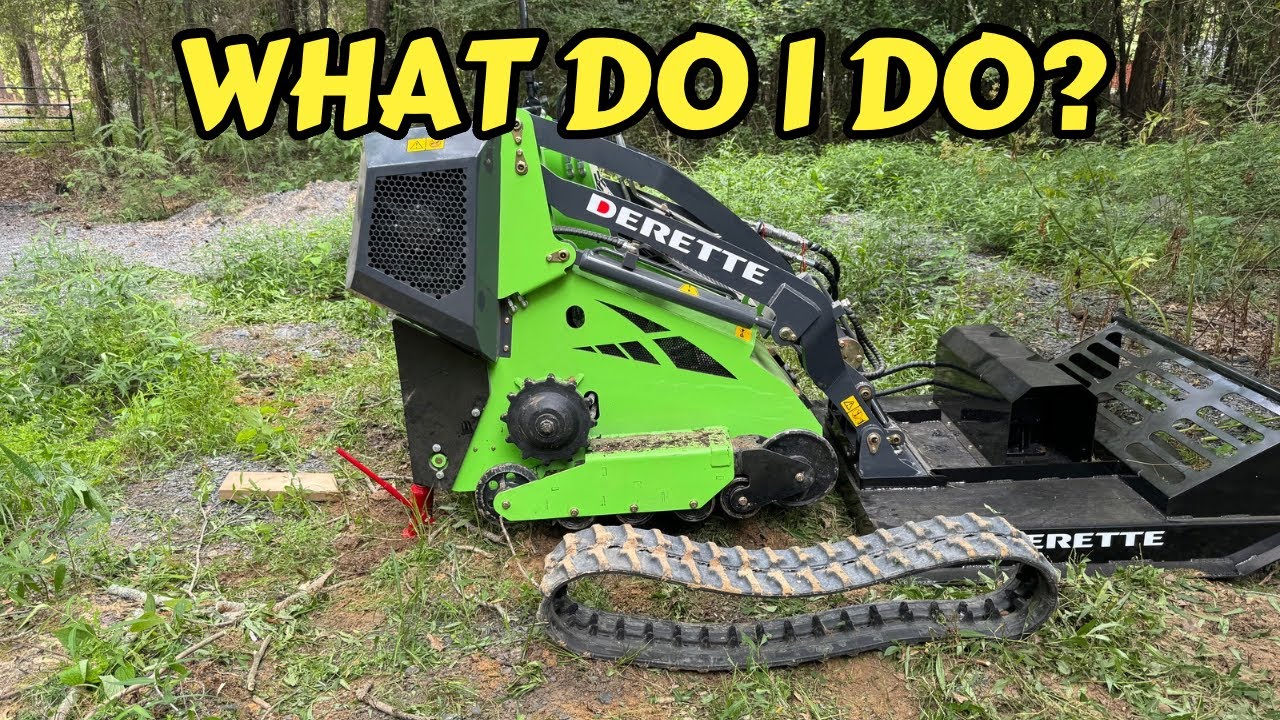 Watch how to put a track back on a mini skid steer easily