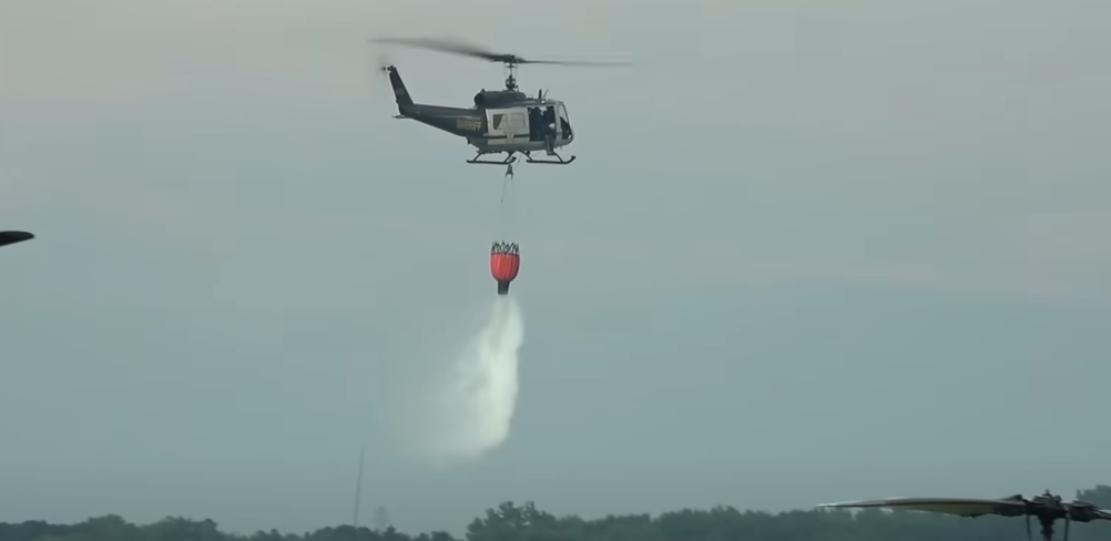 Watch helicopters drop water with unbelievable accuracy over fireworks ...