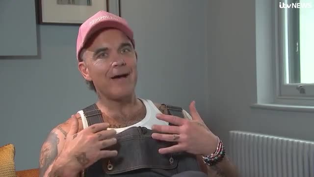 Robbie Williams bans children from having phones, describing them as a ...