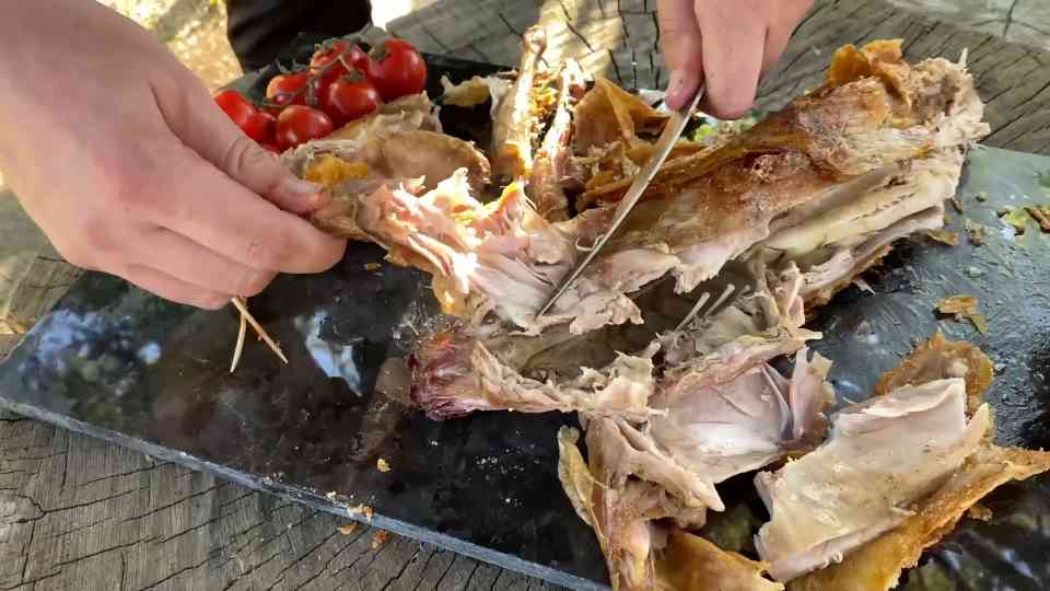 BIG RABBIT SPIT ROASTED IN A TRADITIONAL WAY