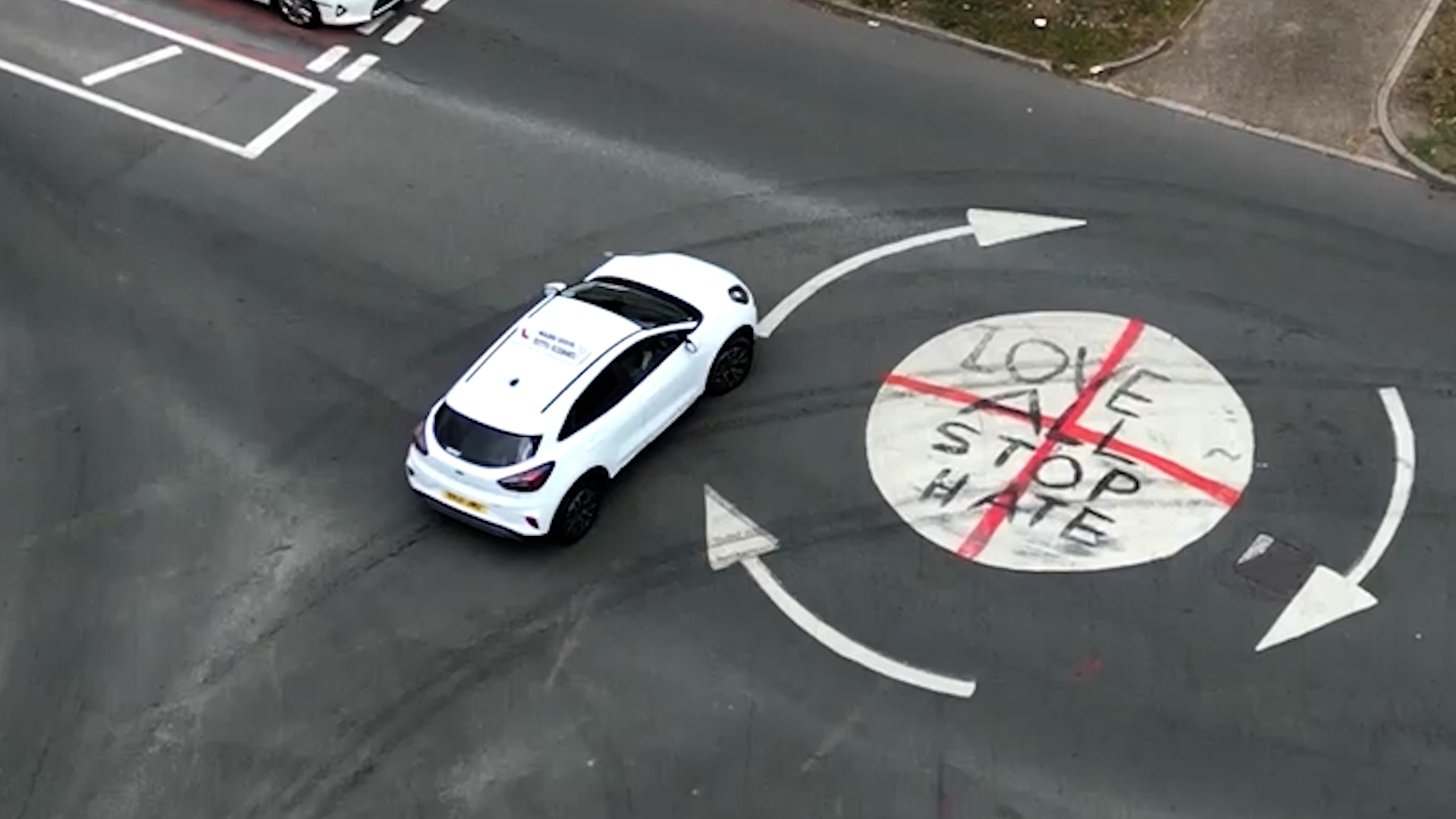 ‘Love All Stop Hate’ painted on Birmingham roundabout amid flag row