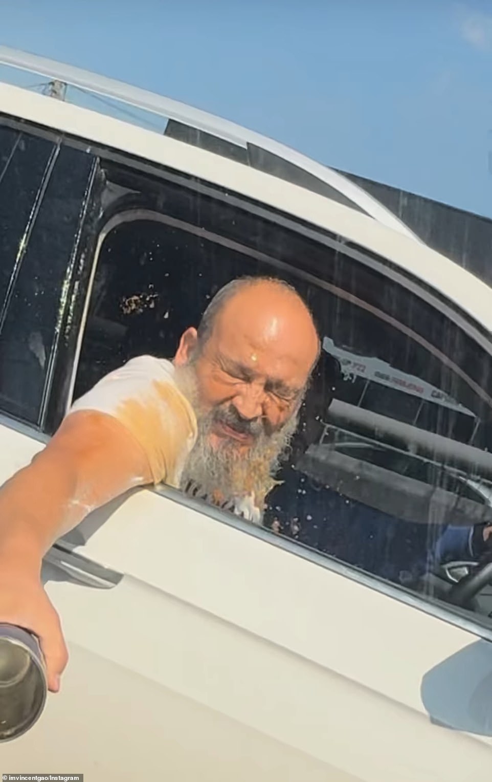 Road-rage passenger hit by instant karma while trying to hurl coffee