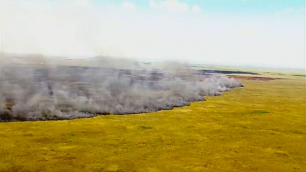 Firefighters battle thick smoke as wildfires burn in Florida's Everglades