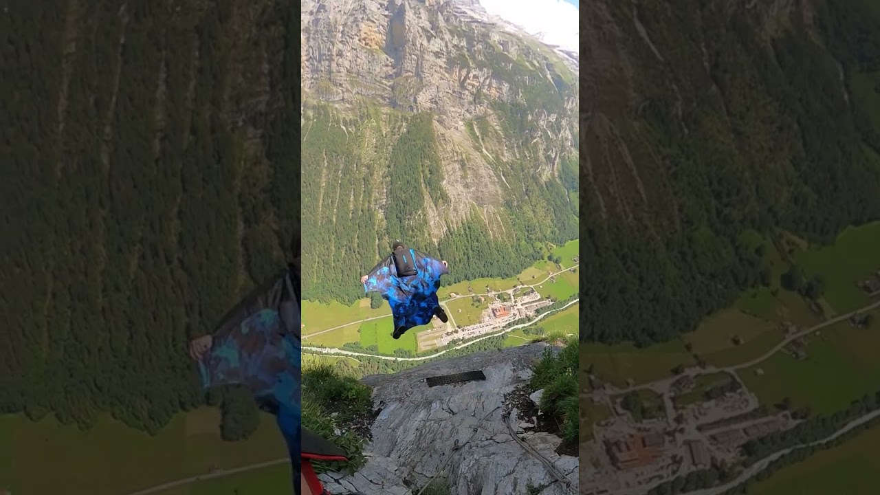 Cliff side wingsuit BASE jump in Switzerland