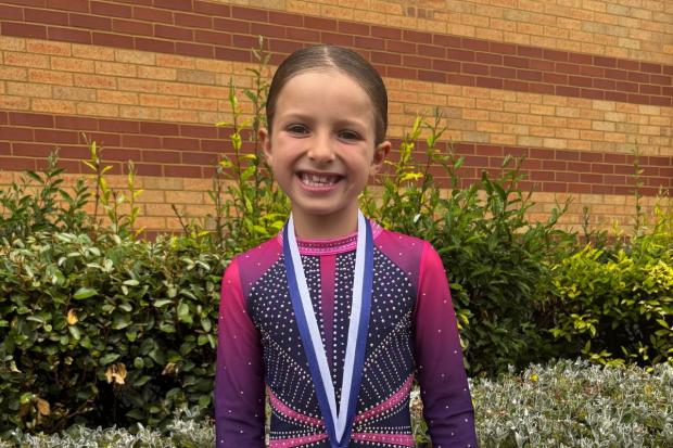 Meet the seven-year-old gymnast winning gold and training with children ...