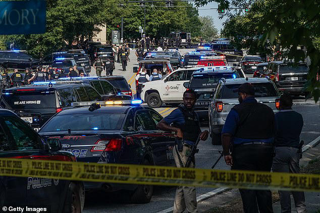 Patrick Joseph White named as shooter who opened fire on CDC and killed cop