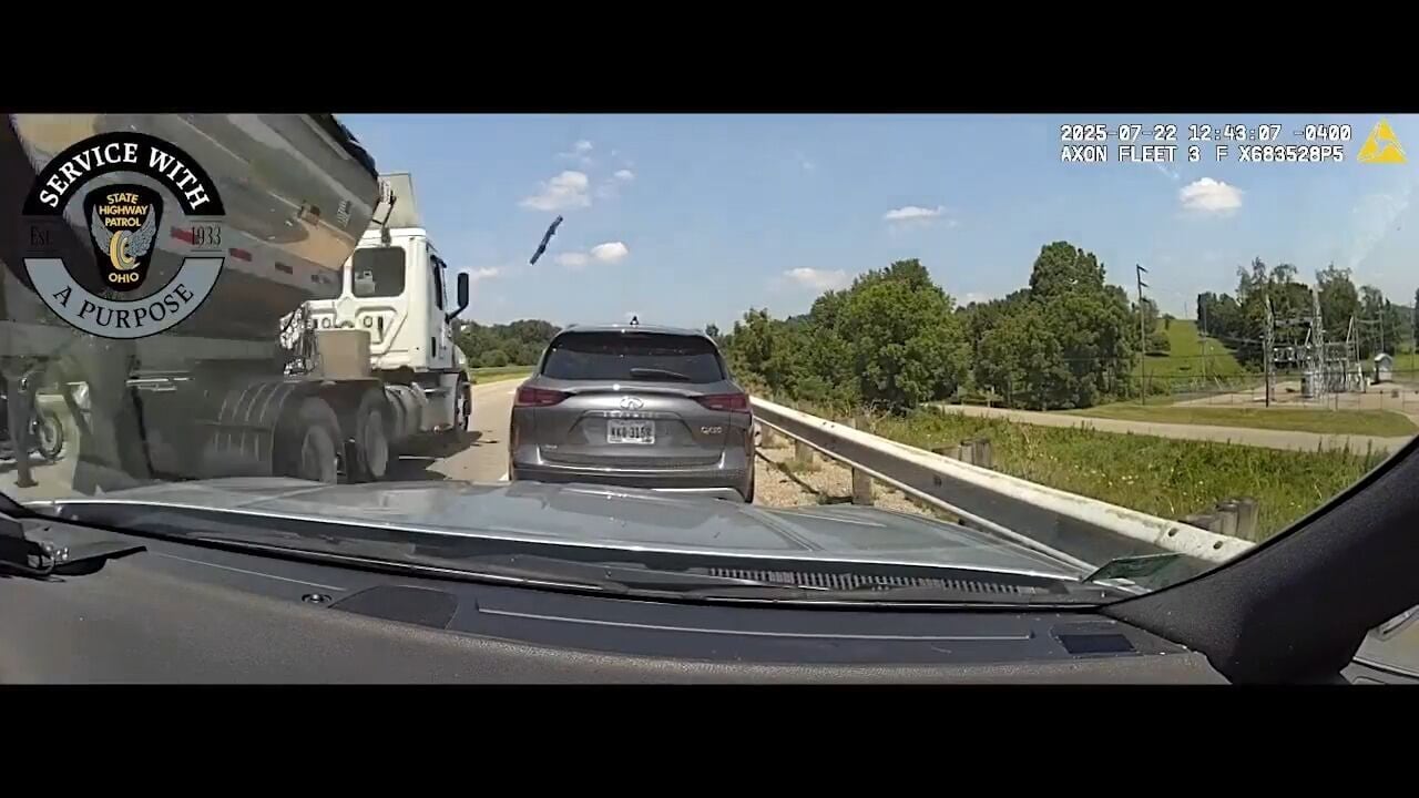 WATCH: ‘Close call;’ Semi almost hits state trooper on traffic stop