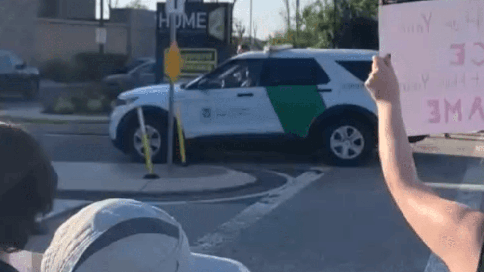 Border patrol cars roll up to hotel during rally against ICE in ...