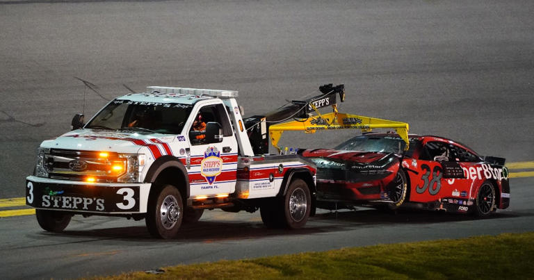 Tow truck takes wrong turn, collides with car on racetrack at Full ...