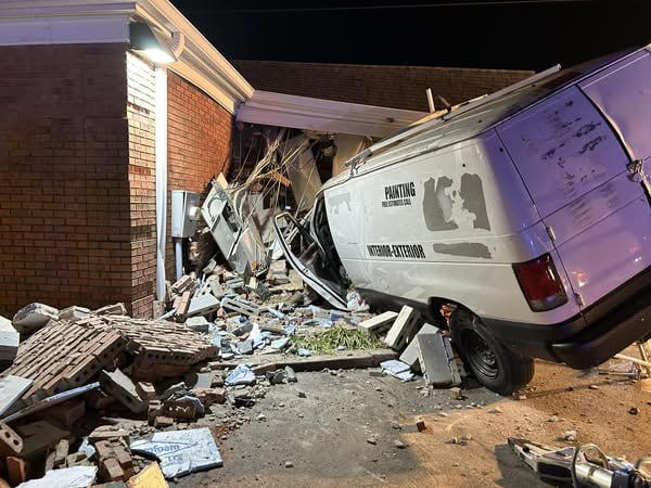Van crashes into building in Midland, causes damage