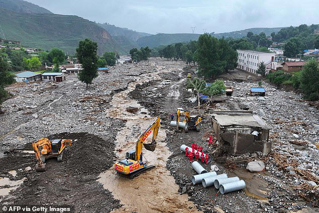 Shock footage of China floods from above: At least 15 are dead and ...