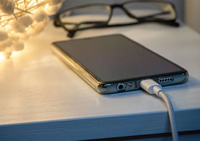 The Hidden Dangers Of Charging Your Phone Next To You While You Sleep