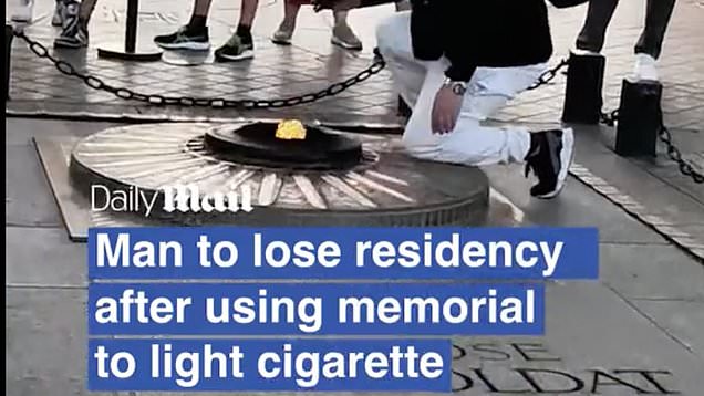 Man under fire after using memorial to light cigarette