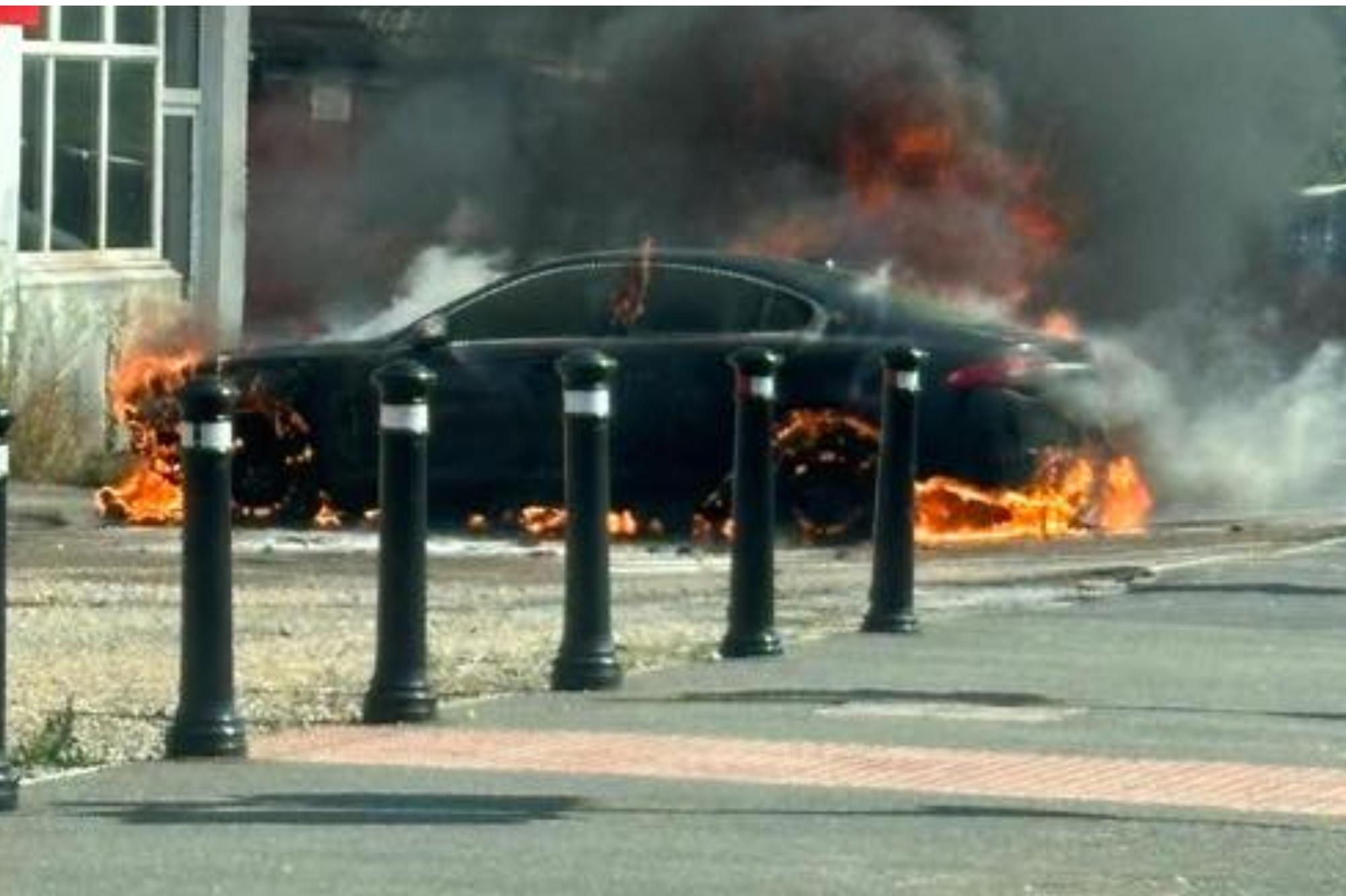 Video: Fire crews tackle blaze as car erupts in flames outside ...