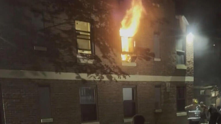 Woman jumps out third-floor window onto mattress to escape Somerville, Massachusetts apartment fire