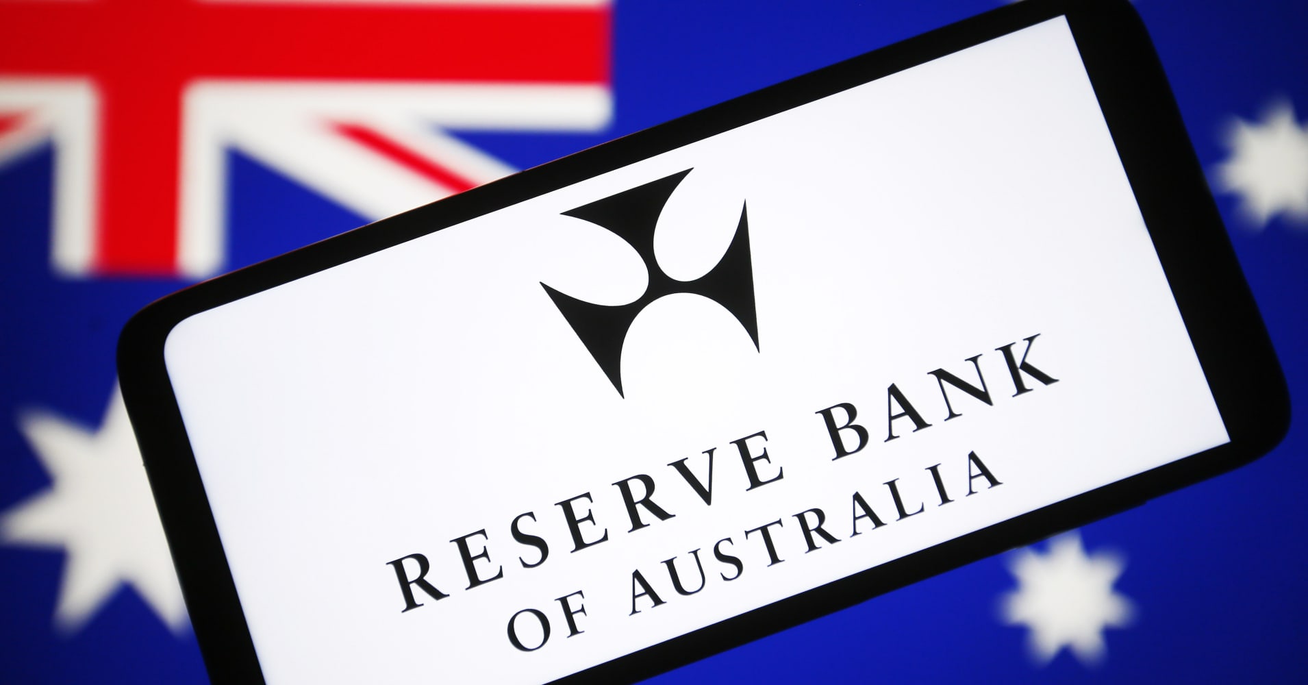 Australia cuts interest rates to more than 2-year lows, downgrades ...