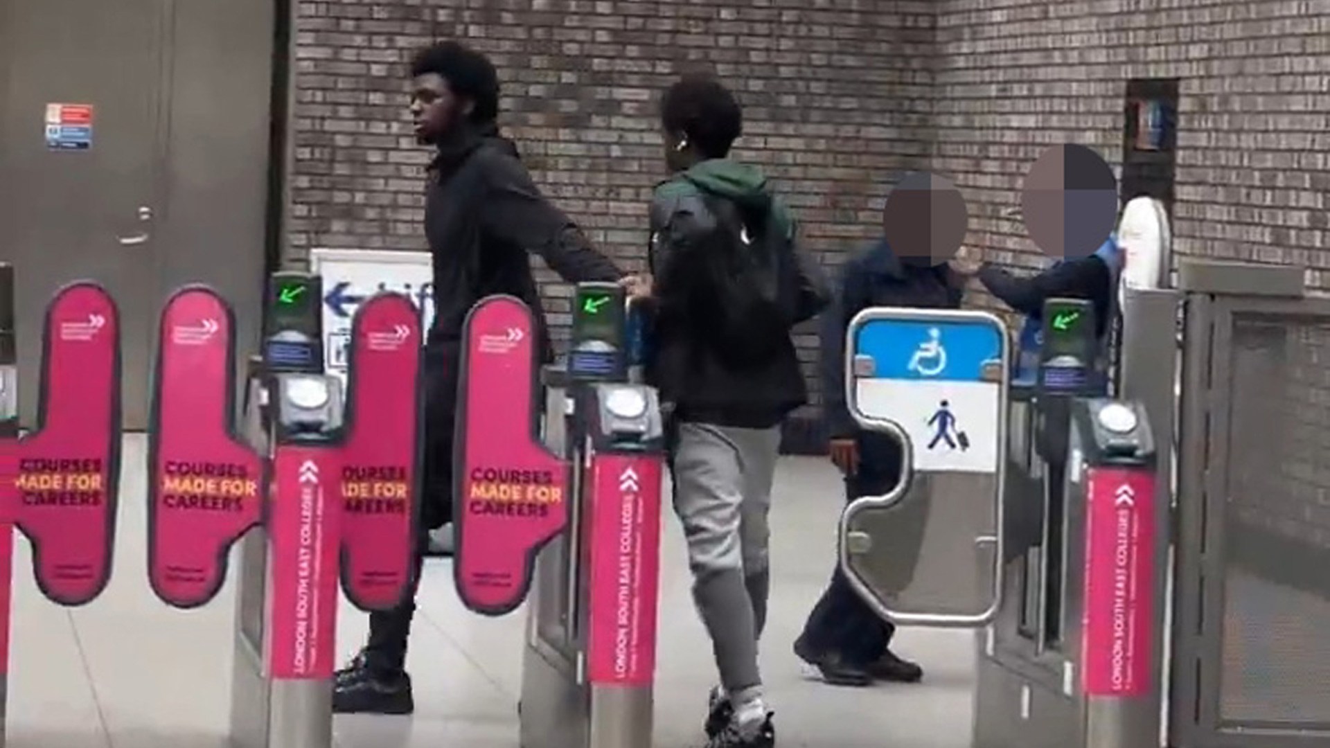 Fare dodgers push their way through barriers