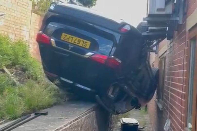 Huddersfield gym trainer's shock as 'runaway' car gets wedged between ...