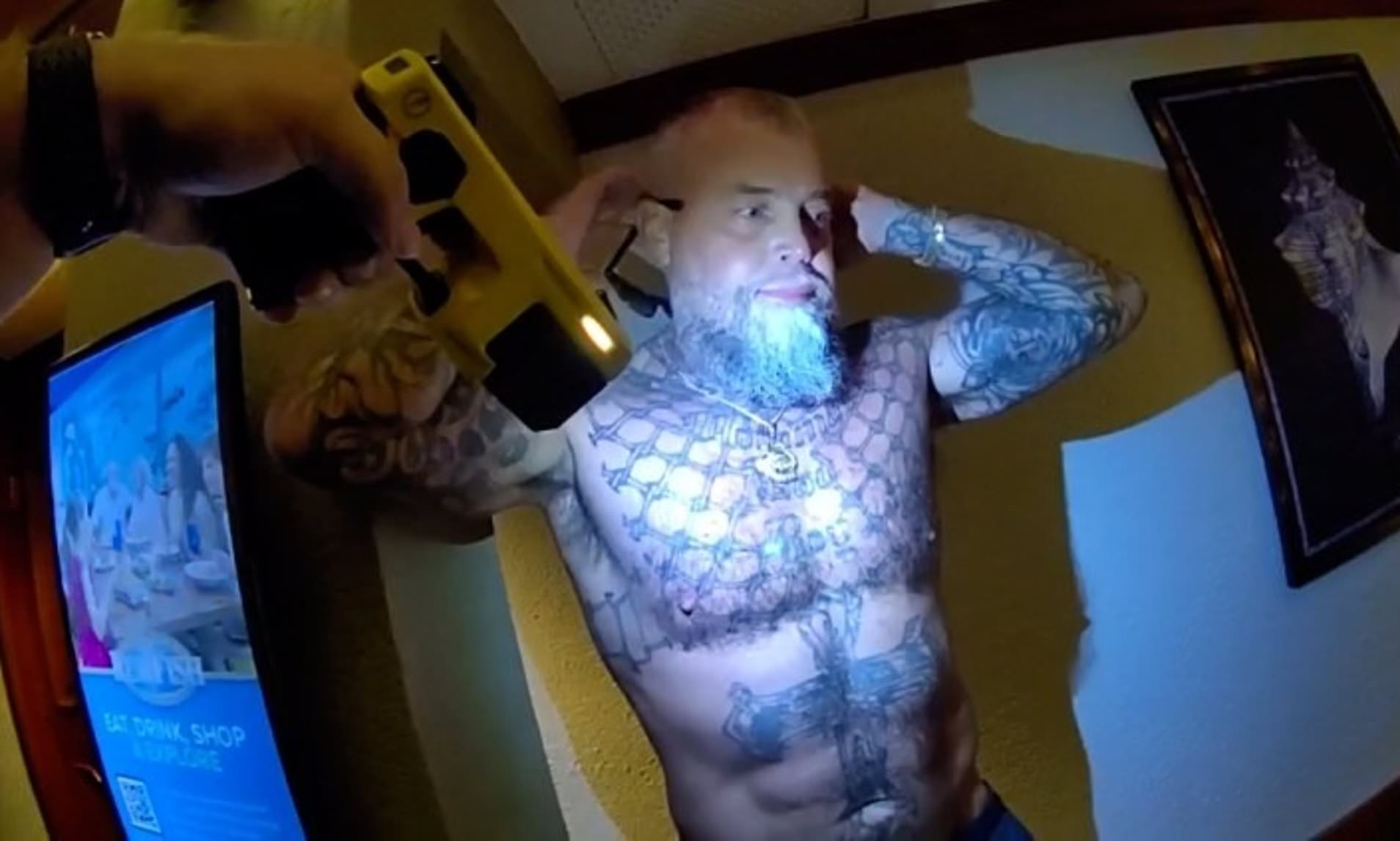 Heavily-tattooed Powerball winner filmed kicking cop in FACE the day ...