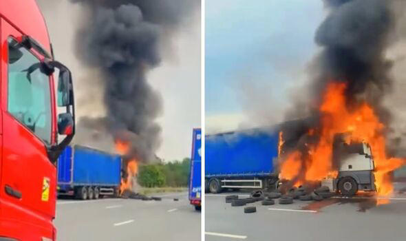 Terrifying moment lorry engulfed in flames on M25 as motorists speed by ...