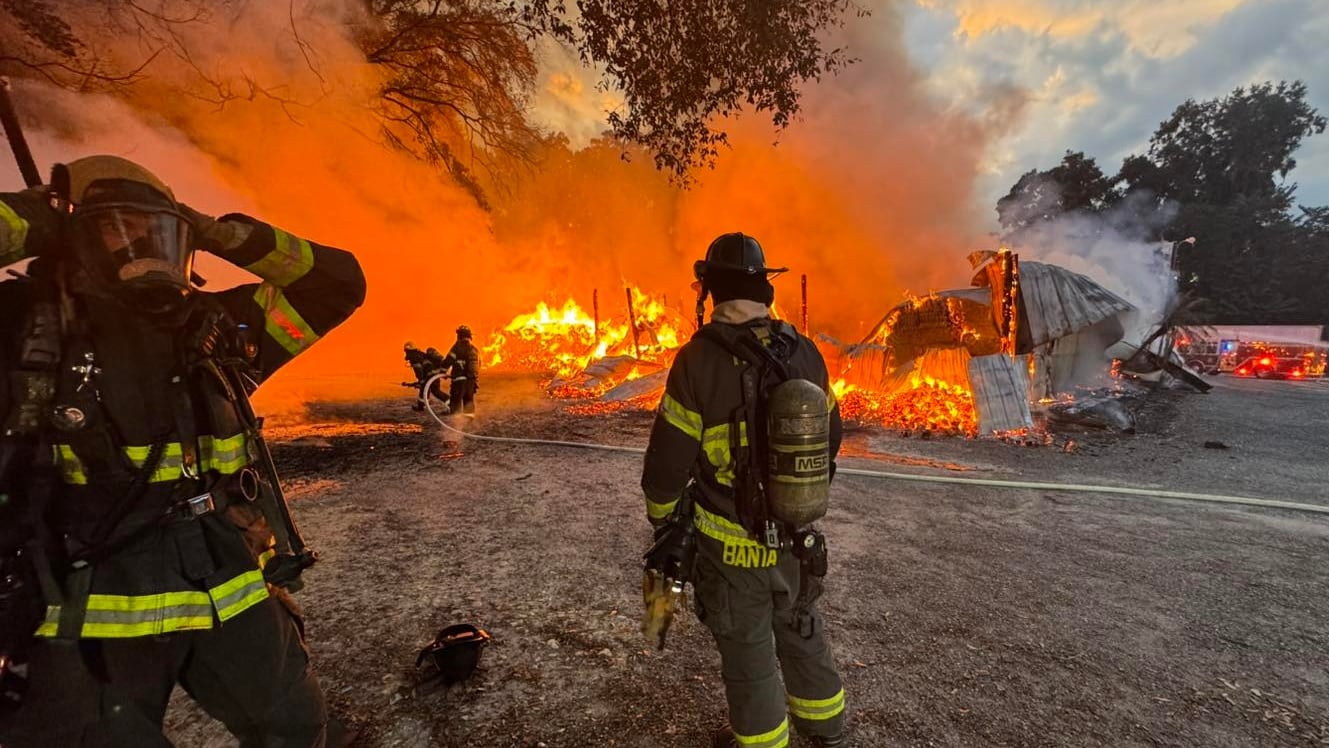 Firefighters battle blaze amid explosions at Marion County feed store
