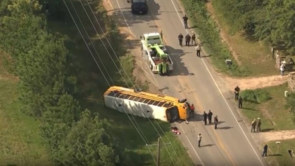 Dozens of students on Liberty County school bus when it flips over