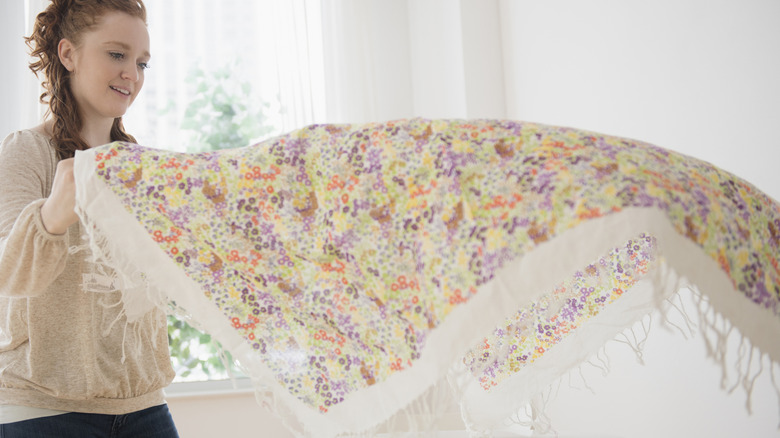 Upholster A Bedframe With Your Favorite Tablecloth Using A Simple DIY