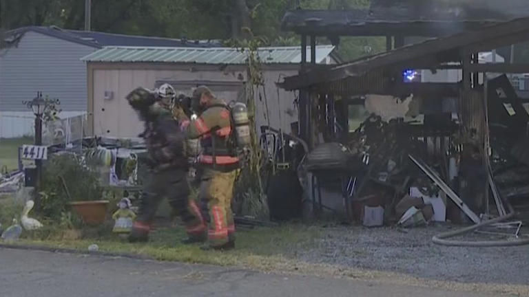 Man rescued from house fire dies